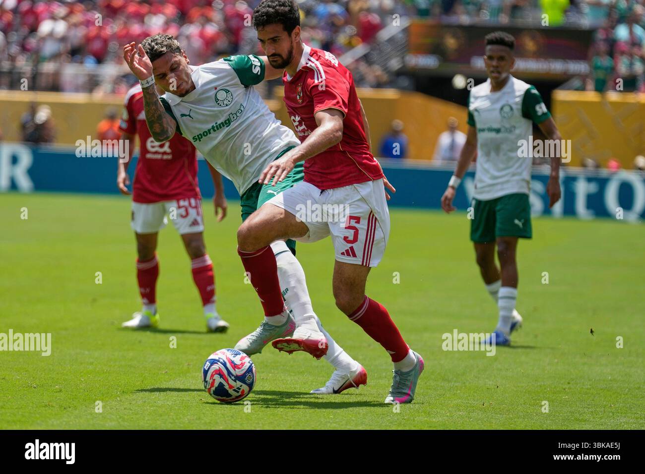 Palmeiras' Richard Rios, left, and Al Ahly's Mohamed Ali Ben Romdhane ...