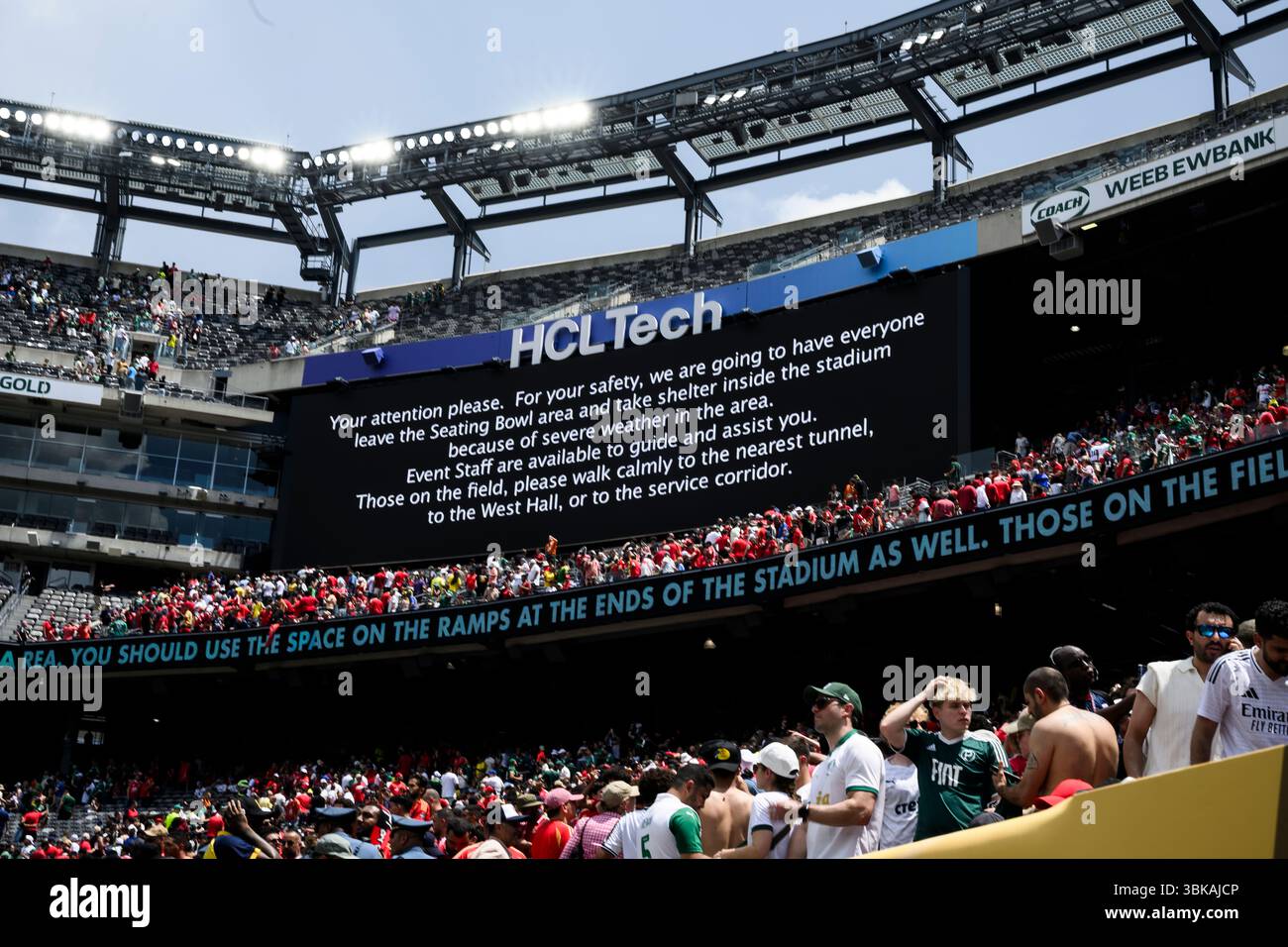 A giant screen display a notice that the match is suspended due to ...