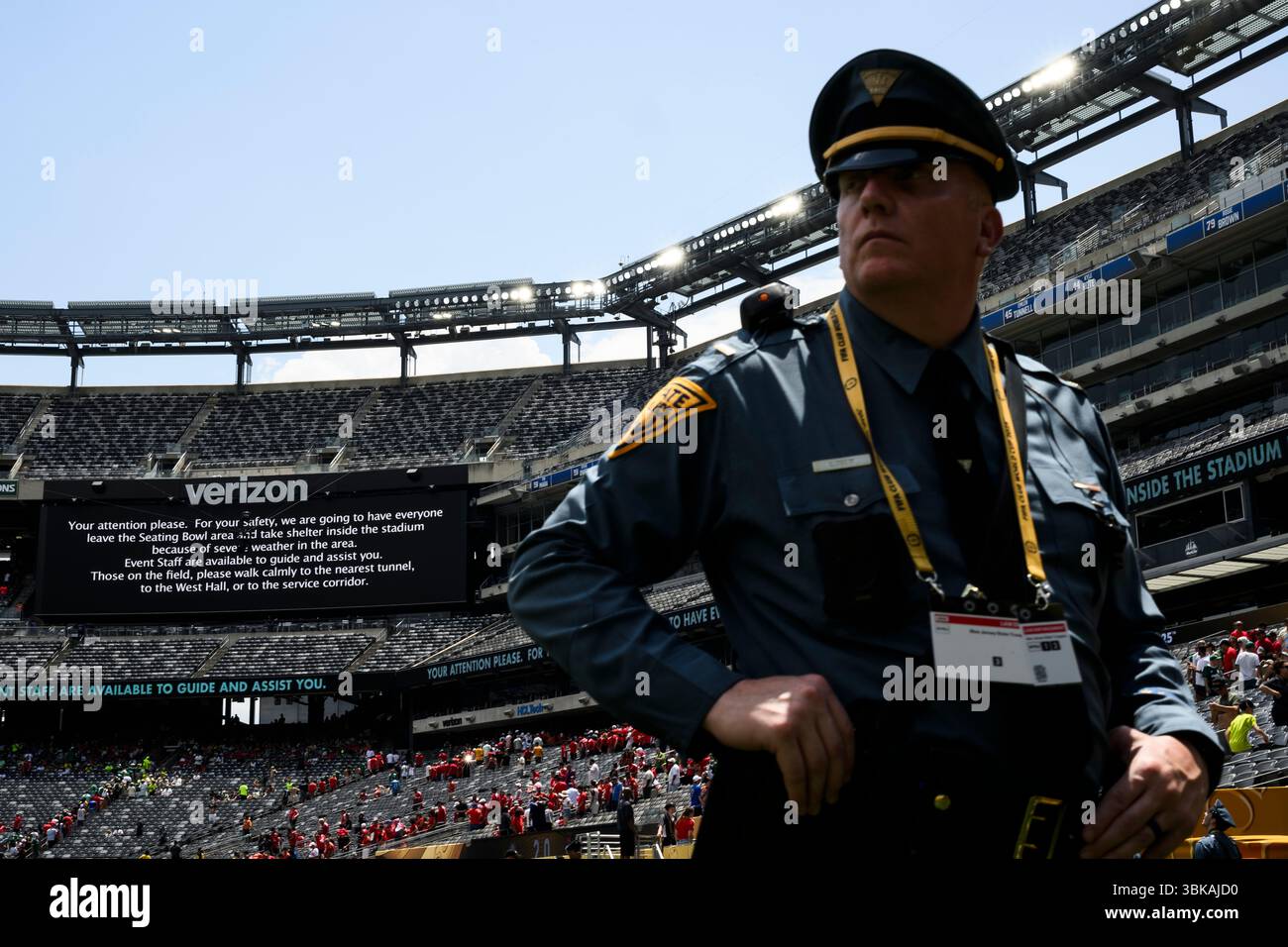 A giant screen display a notice that the match is suspended due to ...