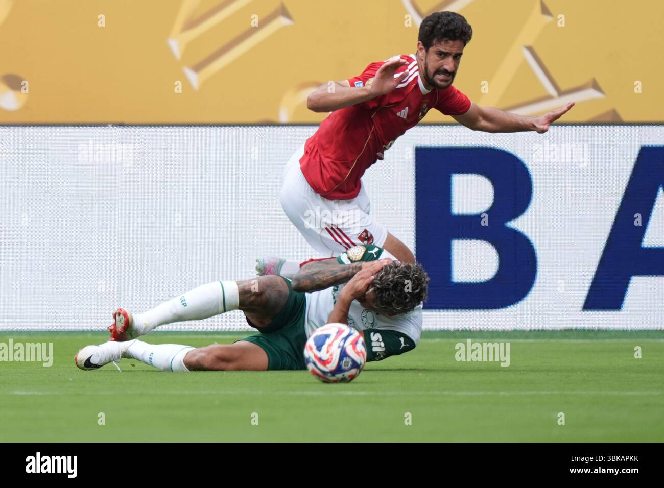 Palmeiras' Richard Rios goes down while battling for the ball against ...