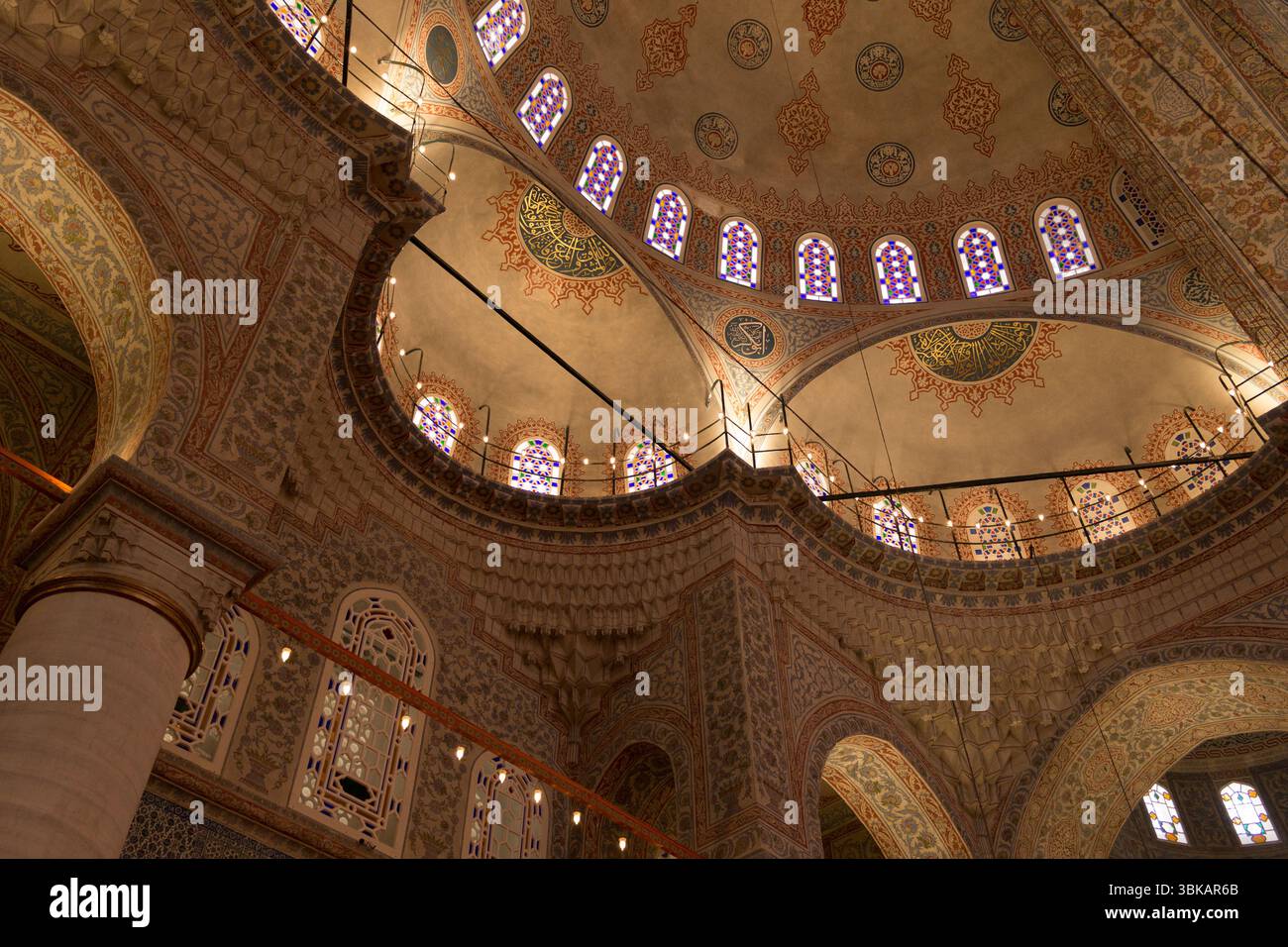 Visitors admire the stunning interior dome of a historic mosque in ...