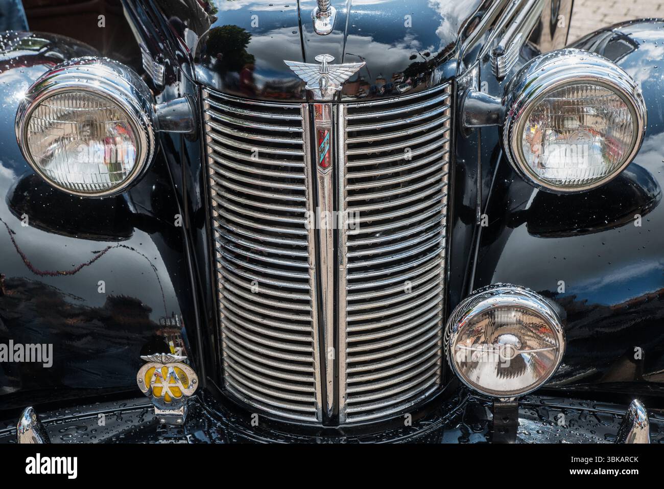A front end view of a 1940s Austin Sixteen with chrome radiator grille ...