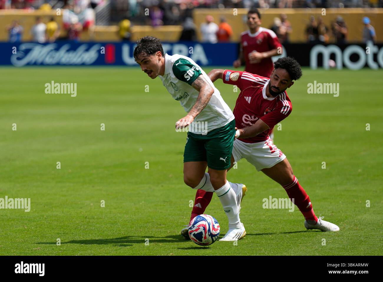 Palmeiras' Mauricio, left, and Al Ahly's Marwan Attia- fight for the ...