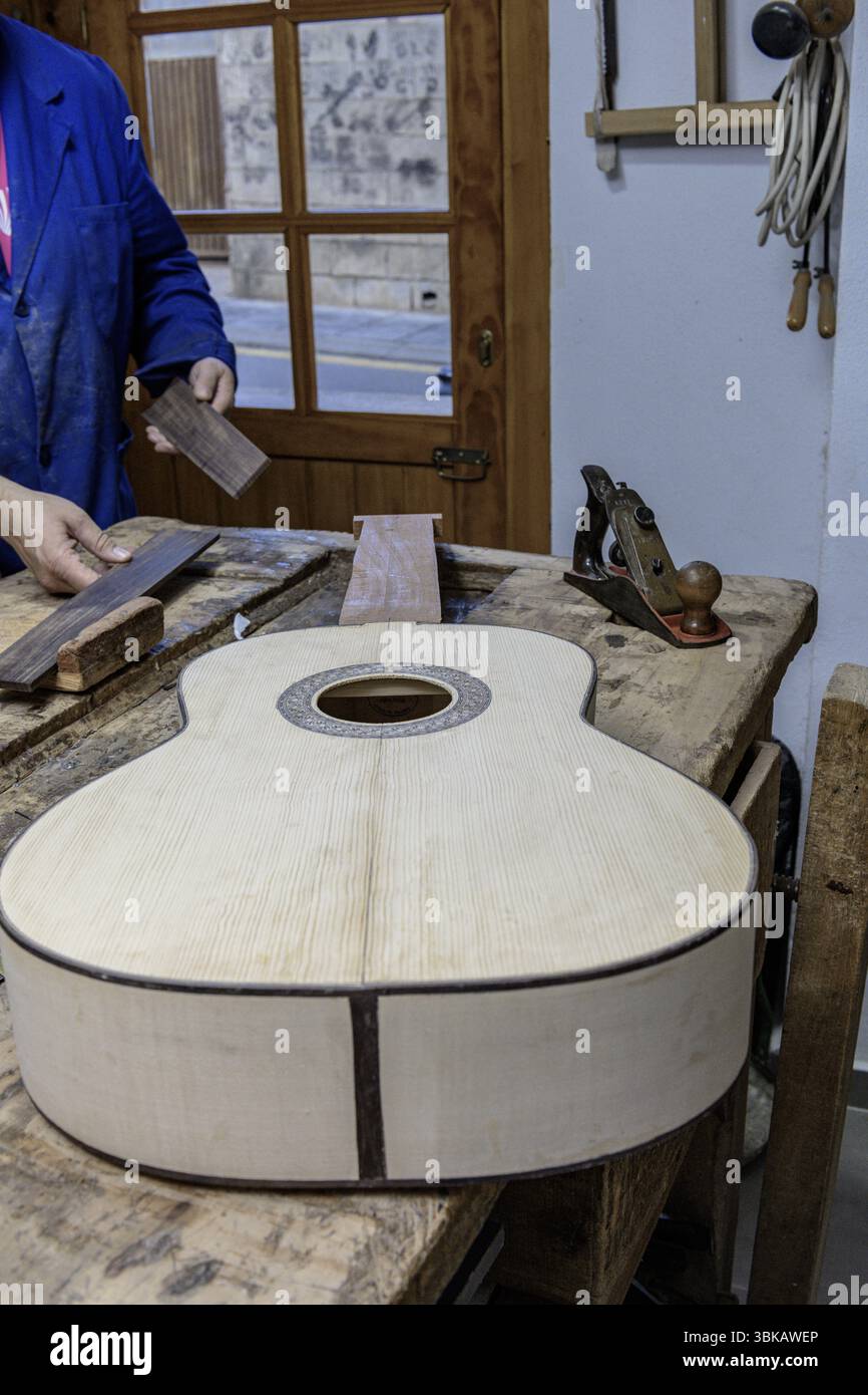 Nearly finished classical guitar body crafted by hand in a luthier's ...
