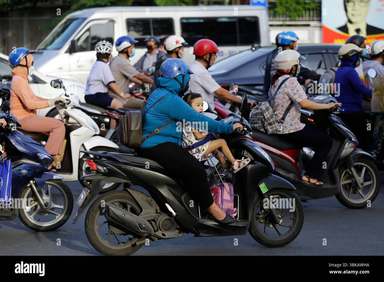Ho Chi Minh City, Vietnam - December 8, 2022: Motorcyclists, some of ...