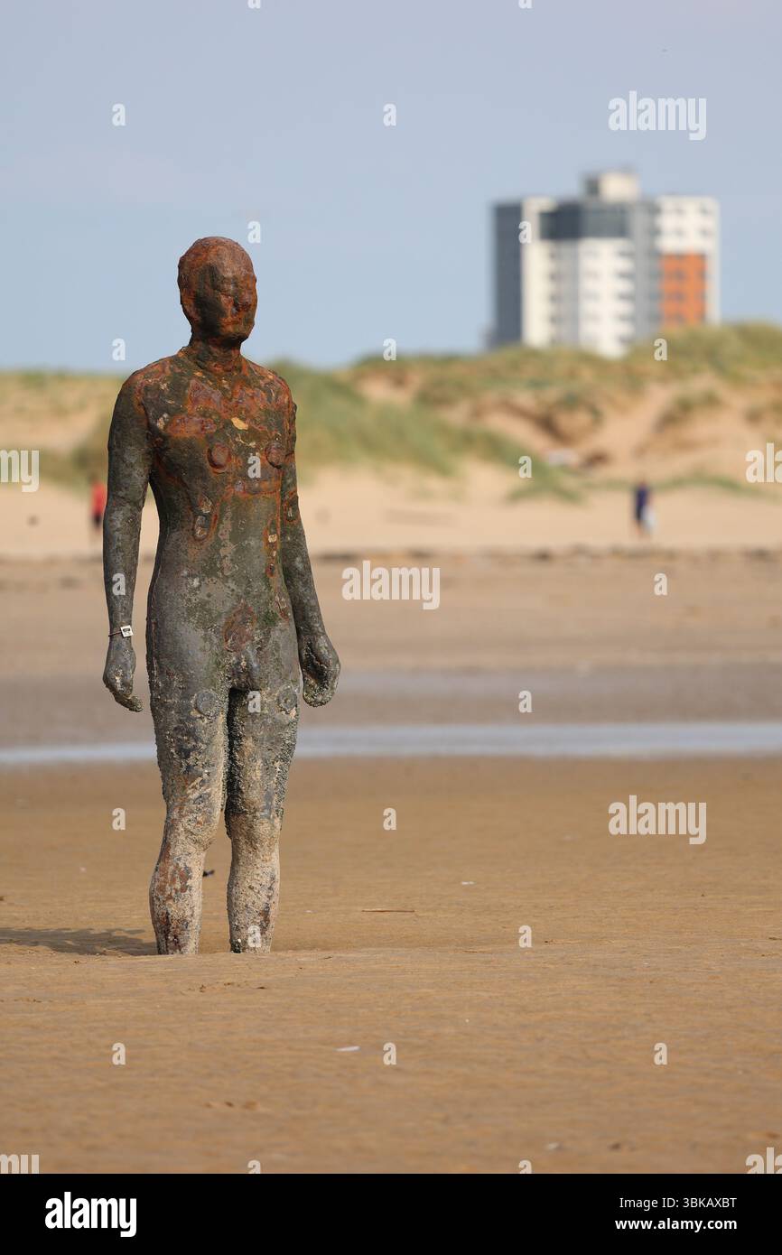 Antony Gormley Another Place figures, Crosby Beach Stock Photo - Alamy
