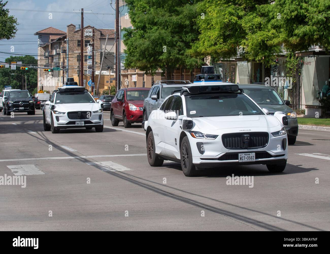 Austin Texas USA, June 19 2025: Two Waymo-branded robo-taxis provide ...