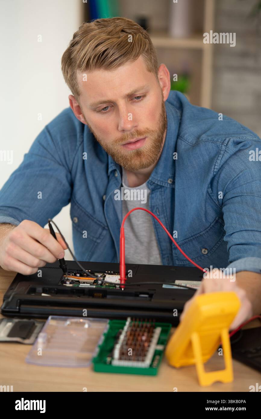 Man multimeter checking computer hi-res stock photography and images ...