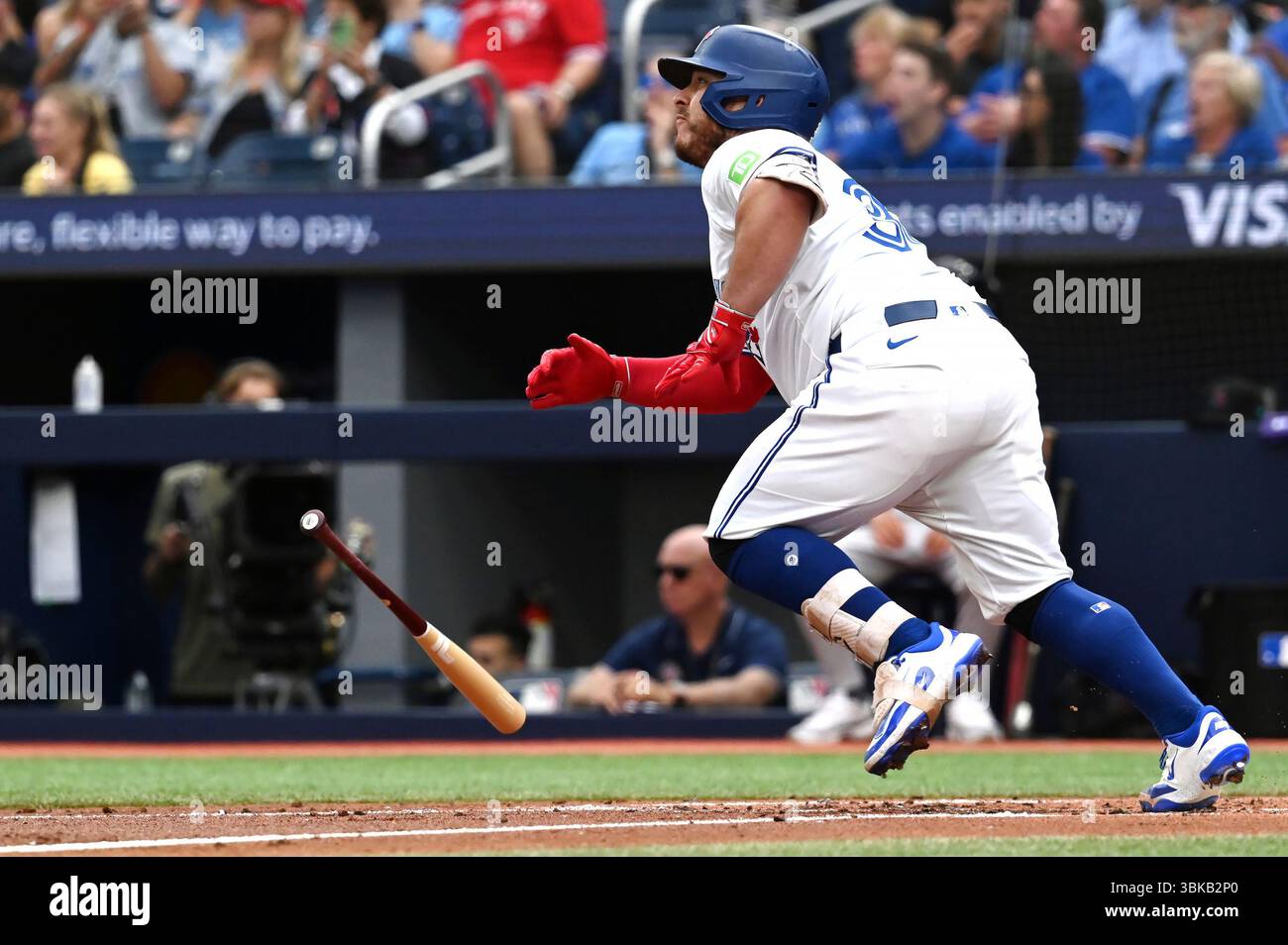 Toronto Blue Jays' Alejandro Kirk watches his solo home run against the ...