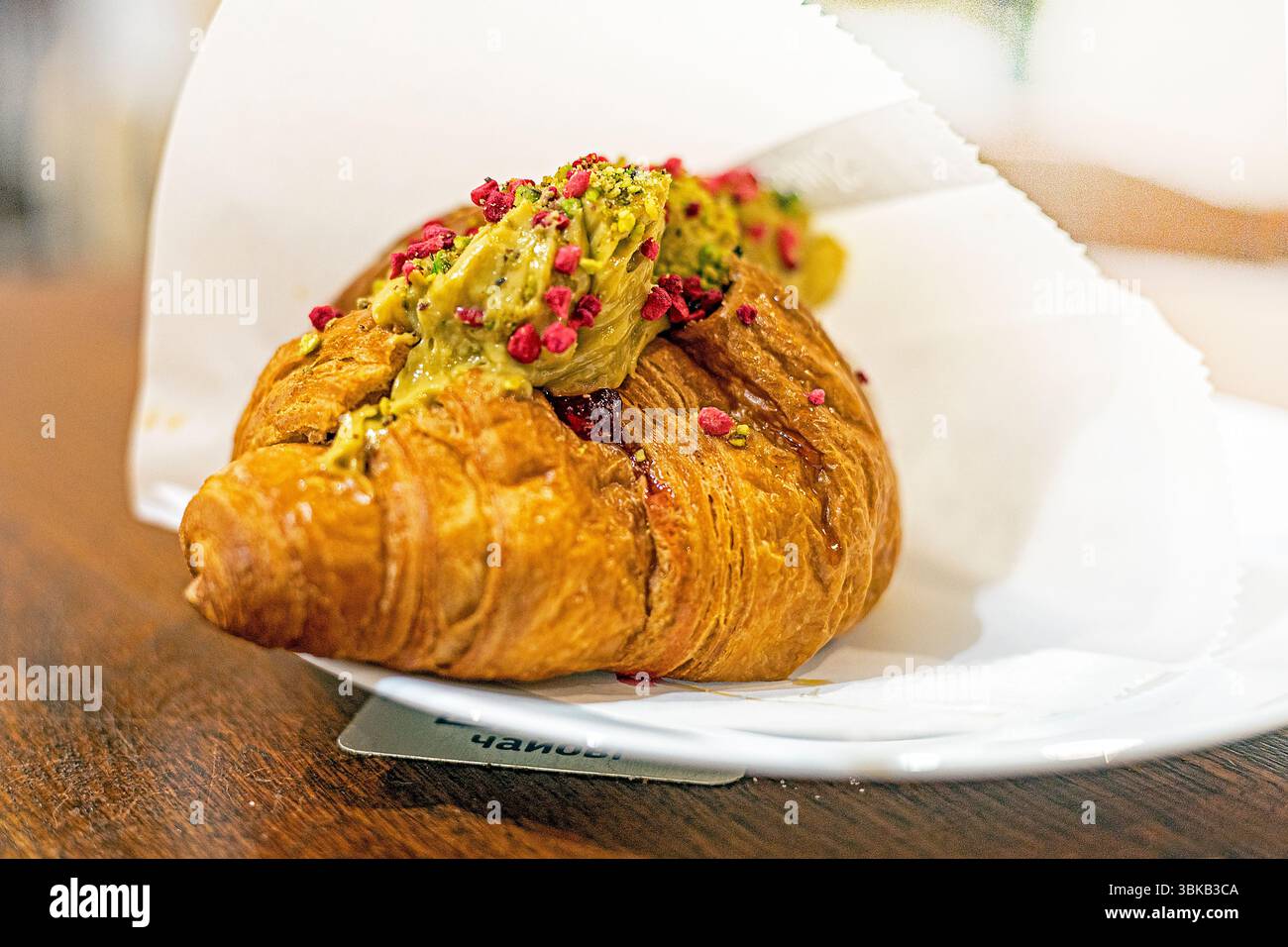 fresh croissant with raspberries and pistachio cream. Good morning ...
