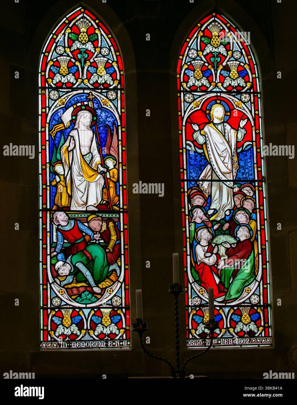 Colorful church stained glass windows depicting religious figures and ...