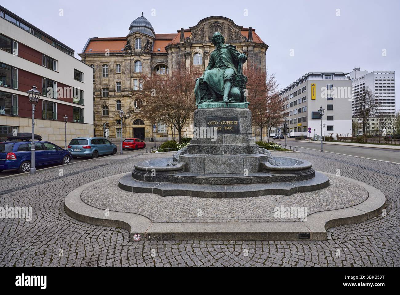 Monument to Otto von Guericke, pavement made of cobblestones, lantern ...