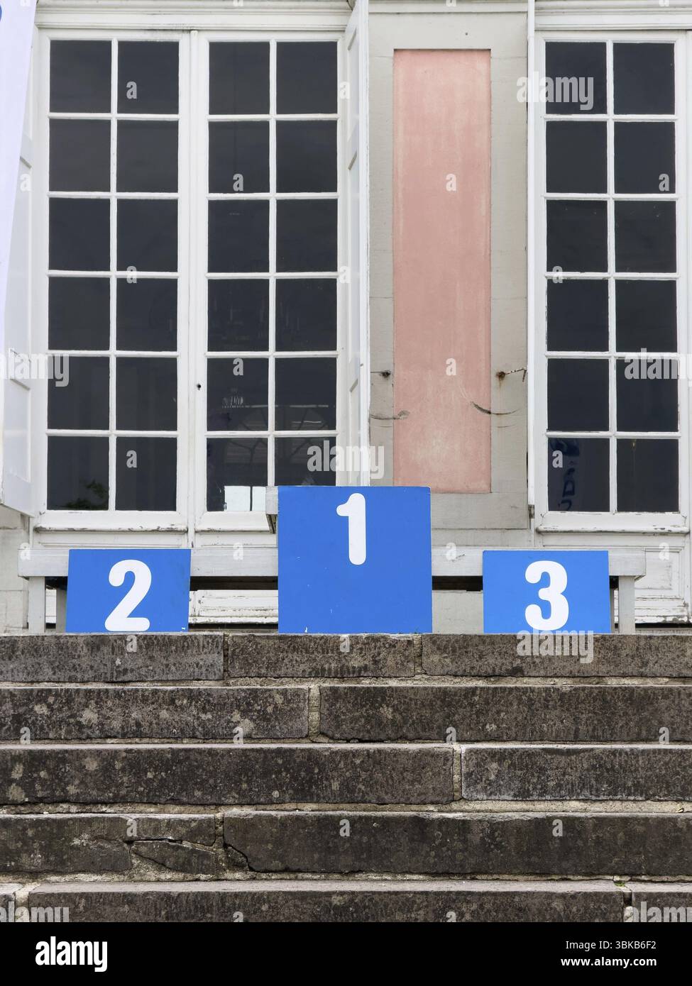 A winner's podium with the numbered places 1, 2 and 3, placed on a ...