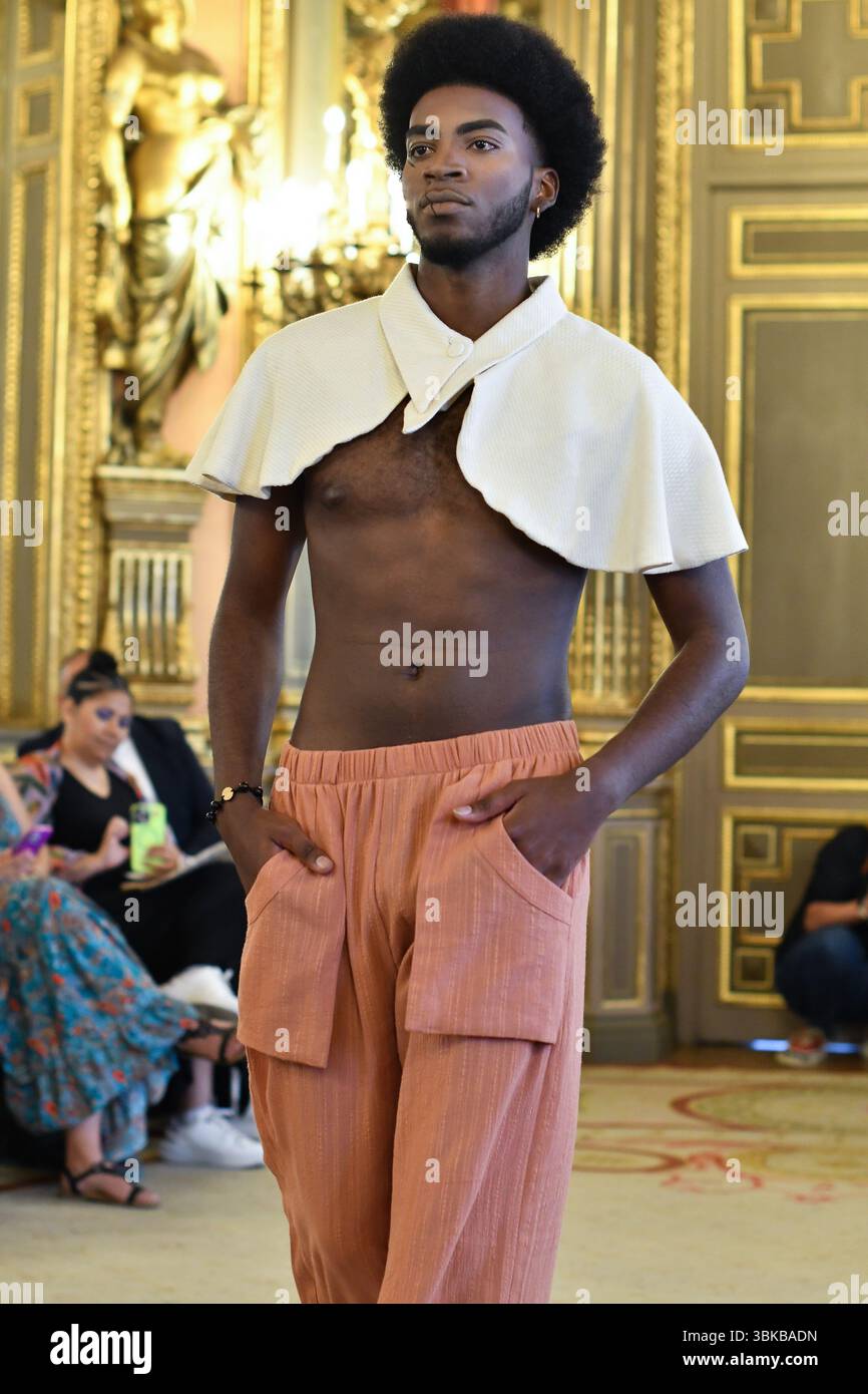 A model walks the runway wearing a Mauricio Figueroa design from the ...