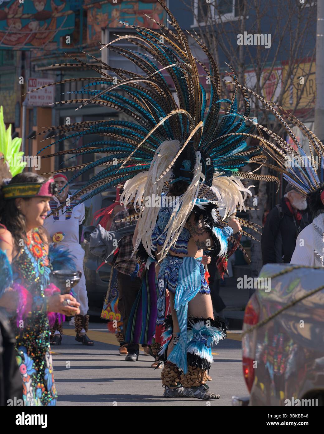 A large group of people wear traditional Central American outfits at a ...