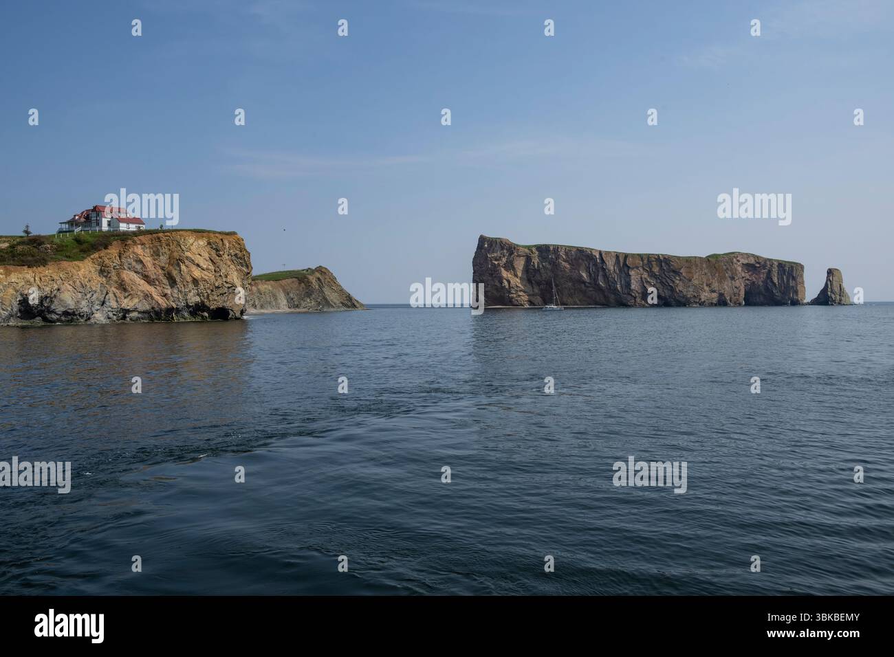 Percé Rock, Perce, rock formation with large hole in it, and Villa ...