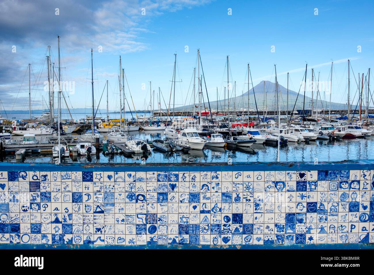 Sailboats at city of Horta marina with Pico Mountain on background ...