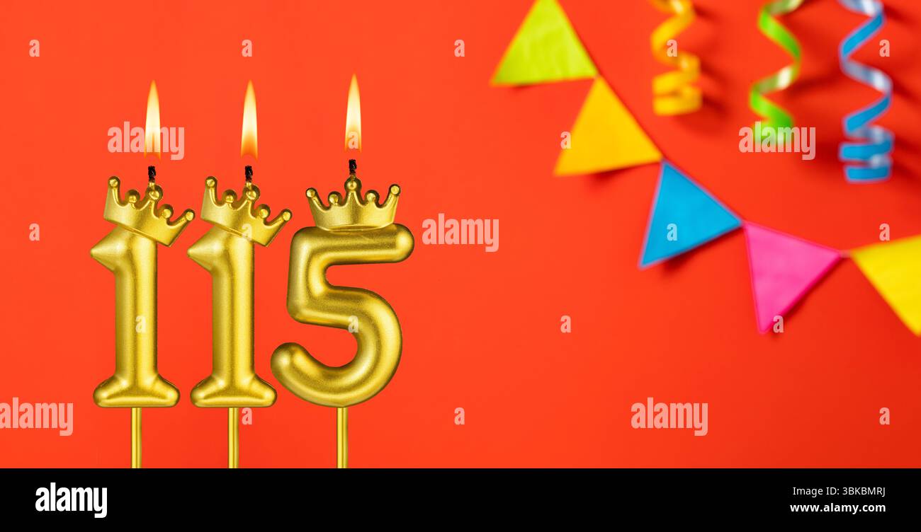 Number 115 birthday candle on an orange background with pennants Stock ...