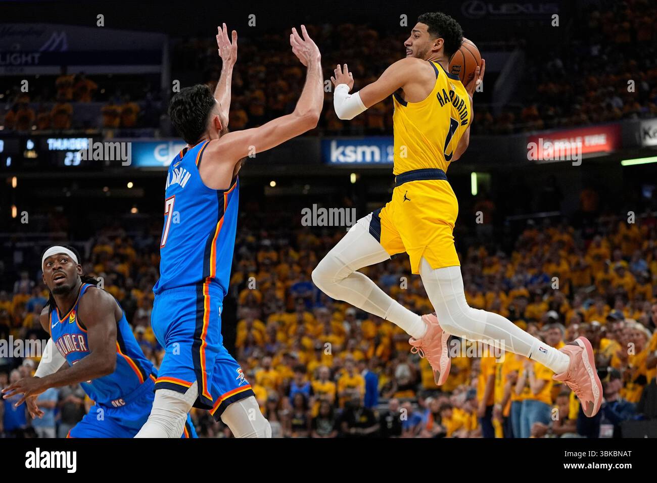 Indiana Pacers guard Tyrese Haliburton, right, passes over Oklahoma ...