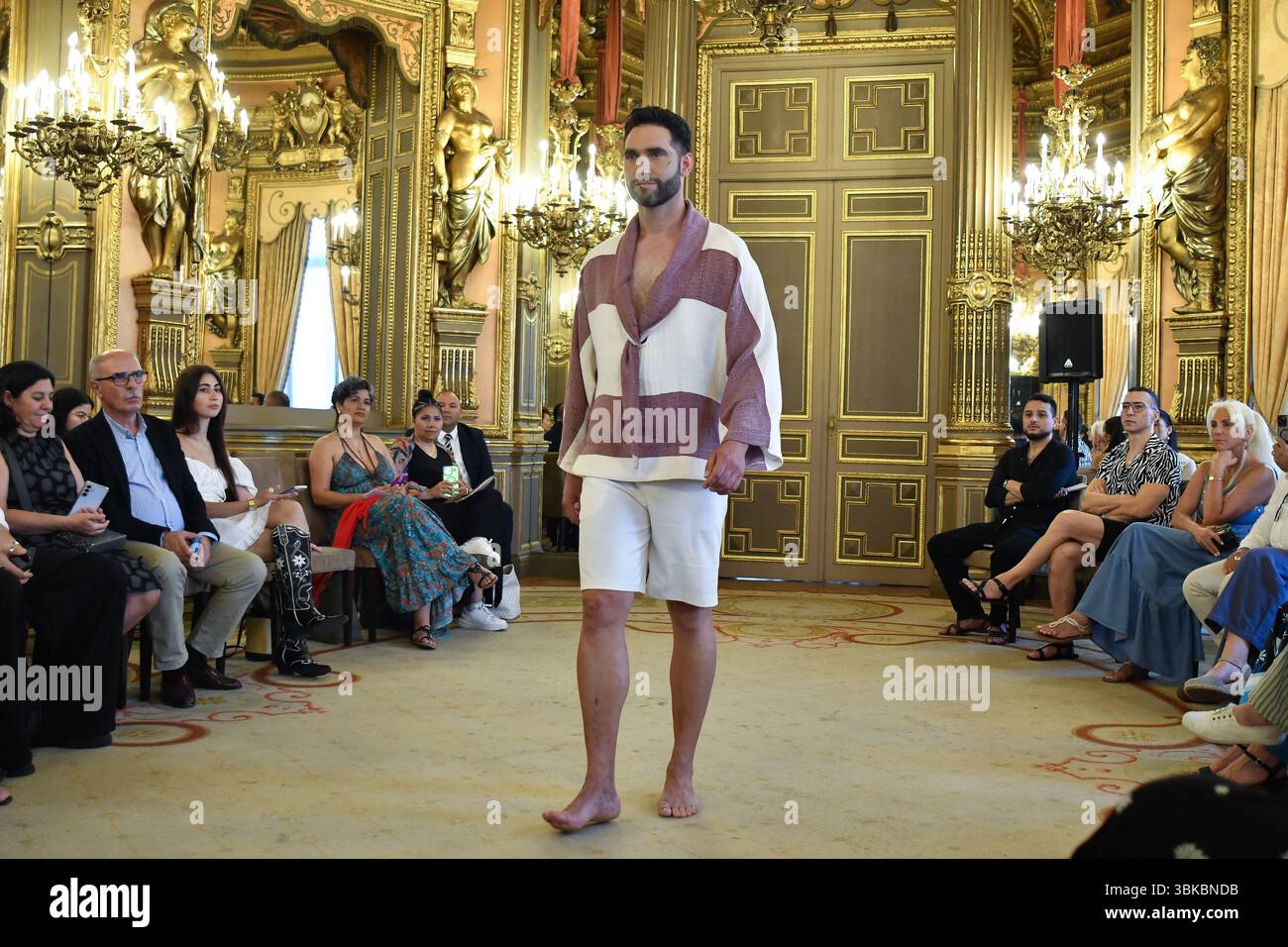 Madrid, Spain. 19th June, 2025. A model walks the runway wearing a ...