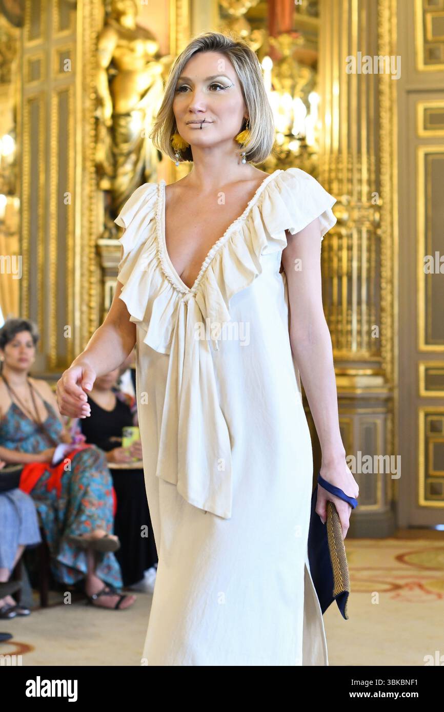 A model walks the runway wearing a Mauricio Figueroa design from the ...