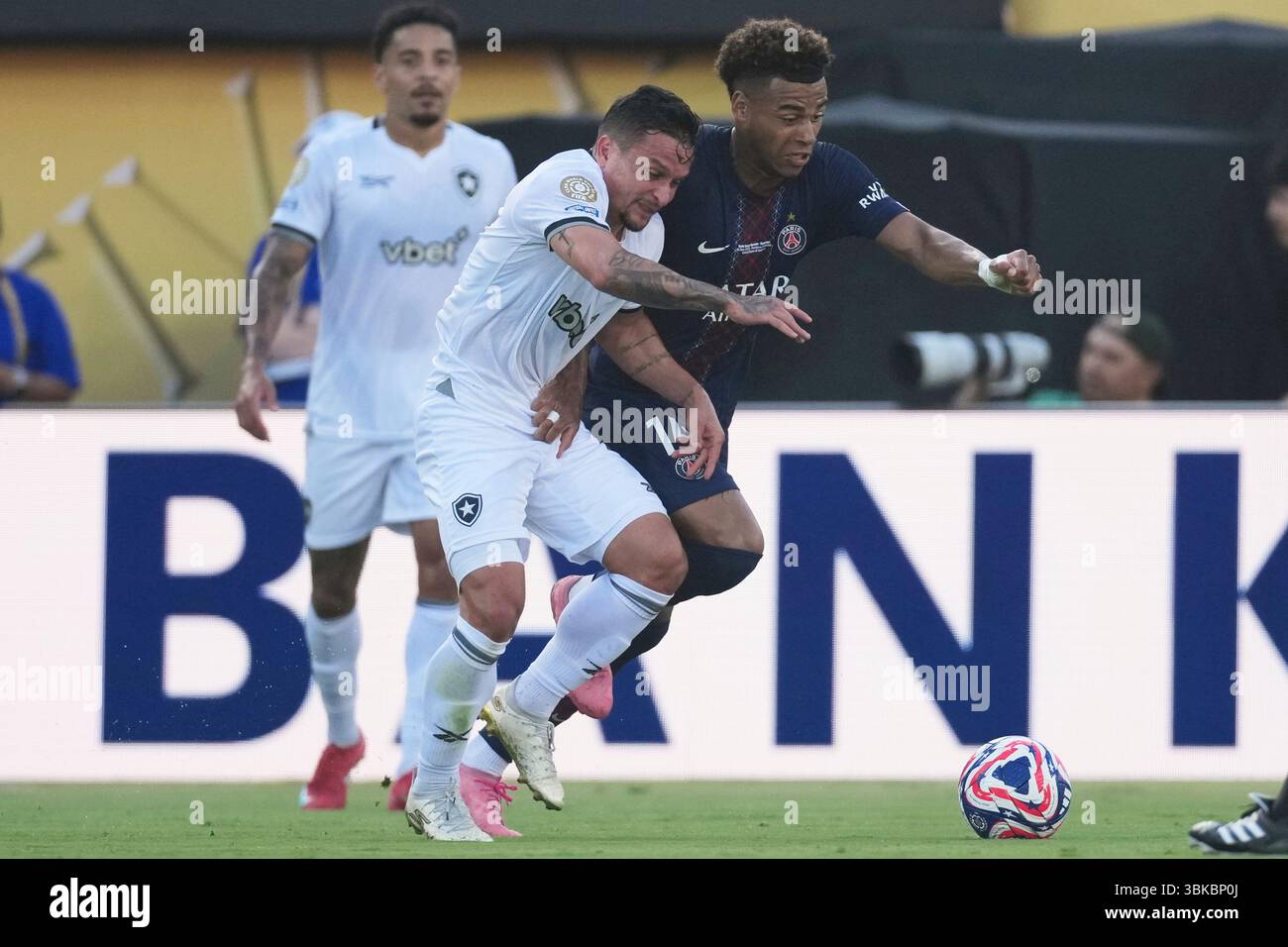 Botafogo's Artur, center, and Paris Saint-Germain's Desire Doue vie for ...