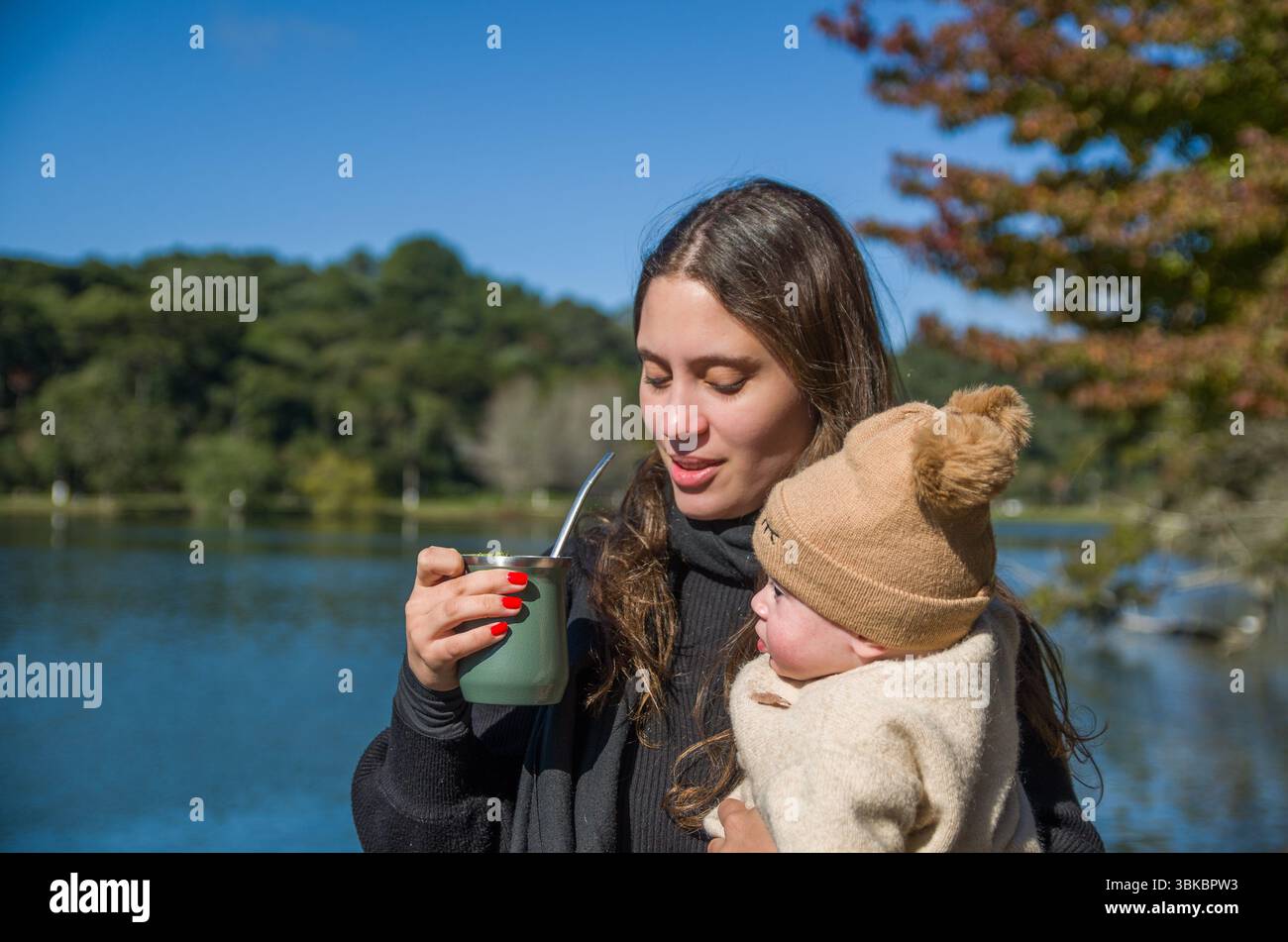Cute baby trying to drink his mother's chimarrão (mate Stock Photo - Alamy