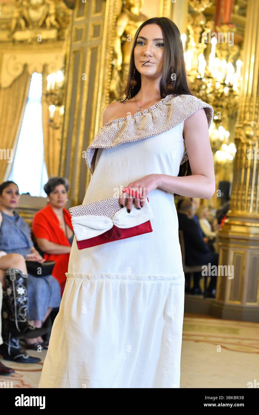 Madrid, Spain. 19th June, 2025. A model walks the runway wearing a ...