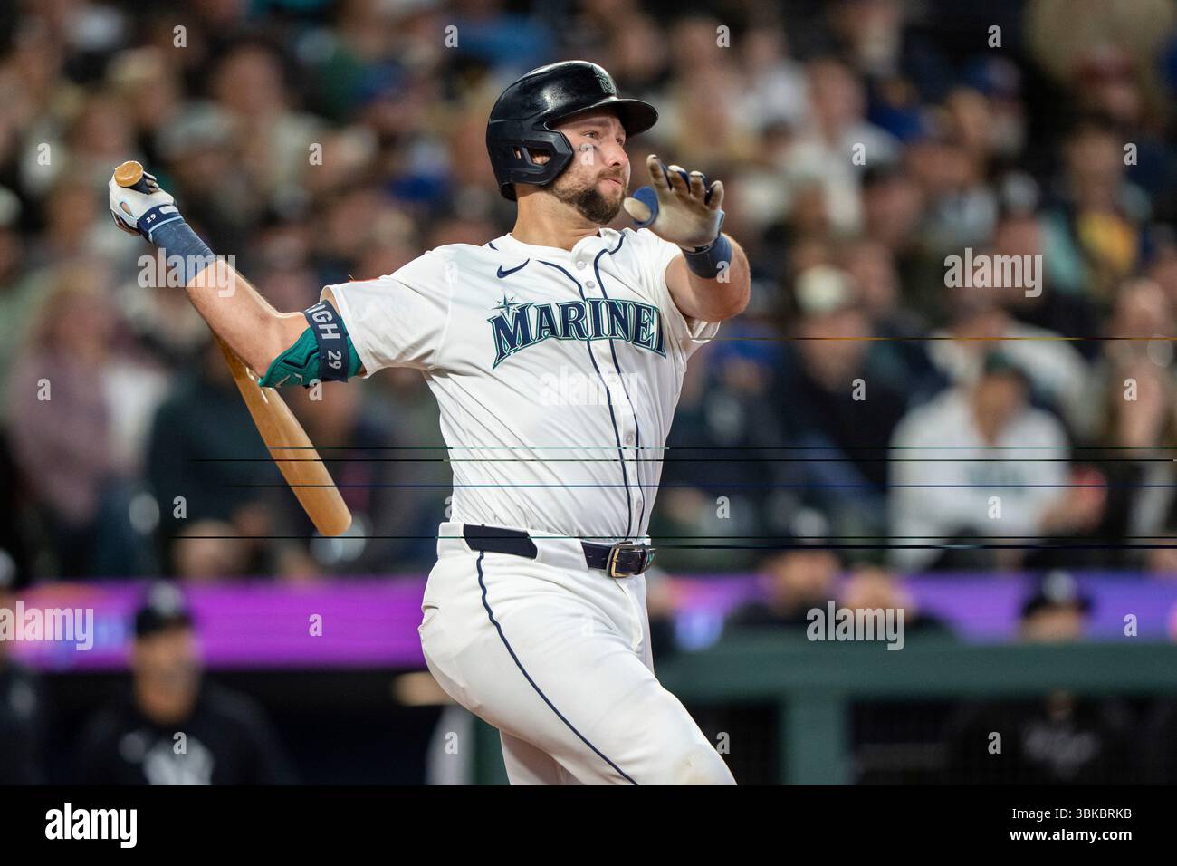 Seattle Mariners' Cal Raleigh takes a swing during an at-bat in a ...