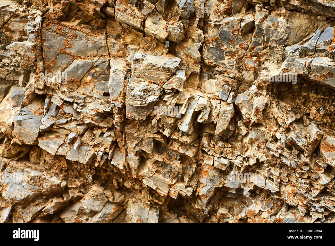 Textured surface of mountain rock with cracks and layers, an ideal ...