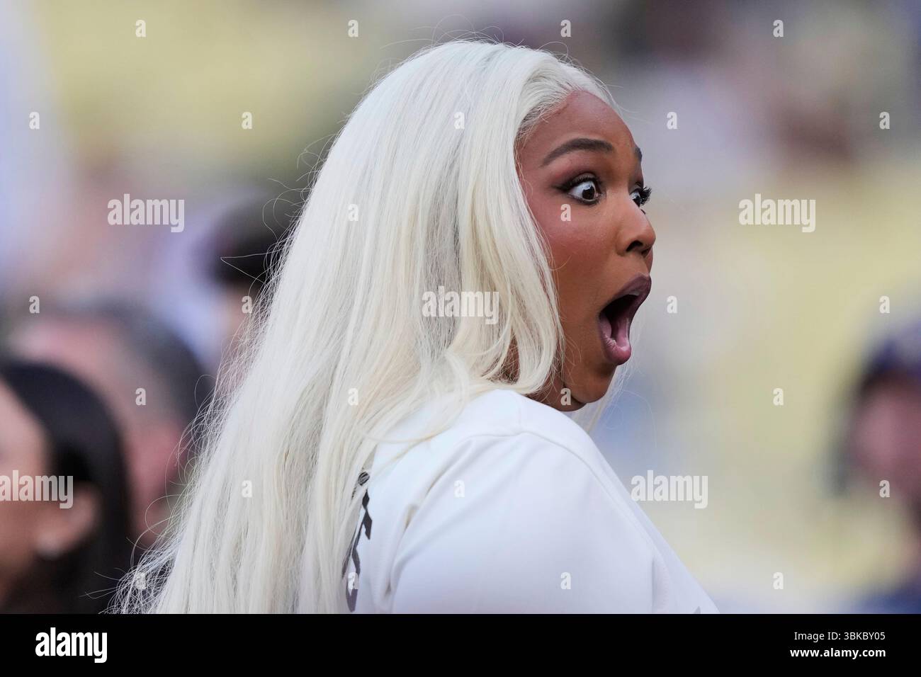 Lizzo reacts as she prepares to the throw the ceremonial first pitch ...