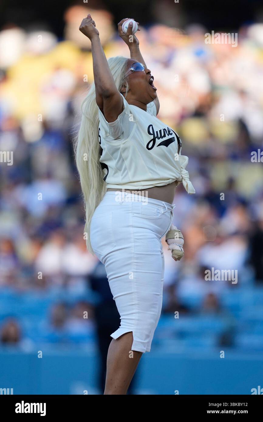 Lizzo reacts as she prepares to the throw the ceremonial first pitch ...