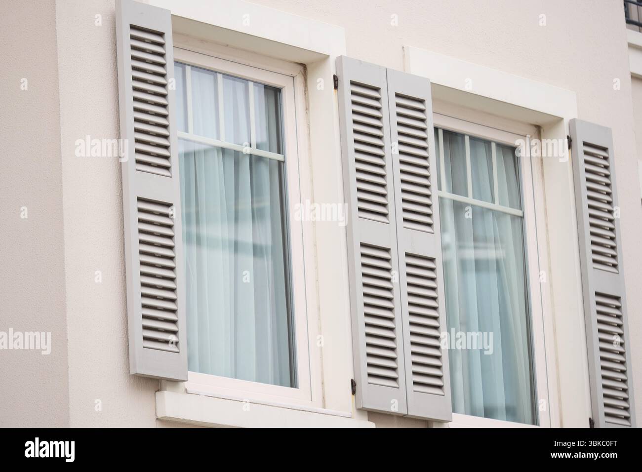 Elegant shutters on windows in a modern building exterior Stock Photo ...