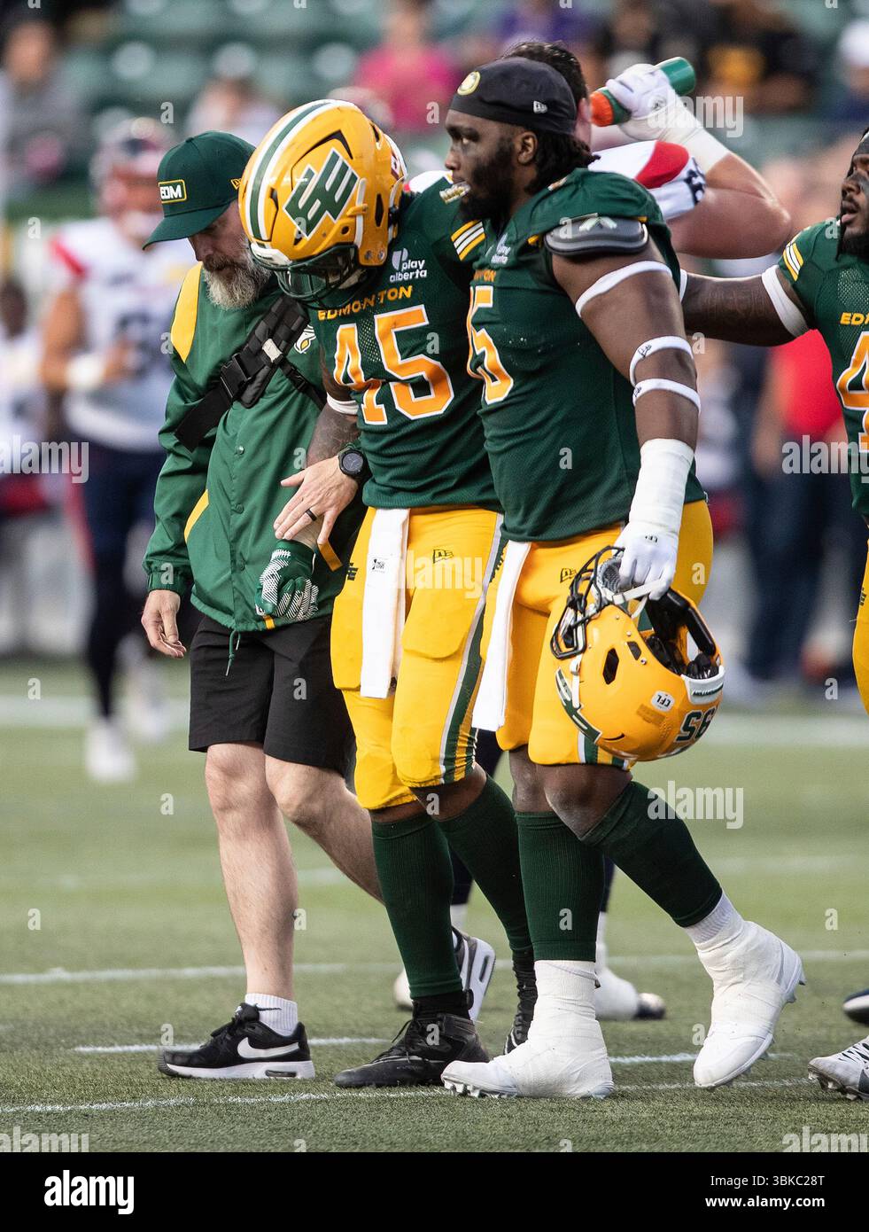 Edmonton Elks' Nyles Morgan (45) is helped off the field after being ...