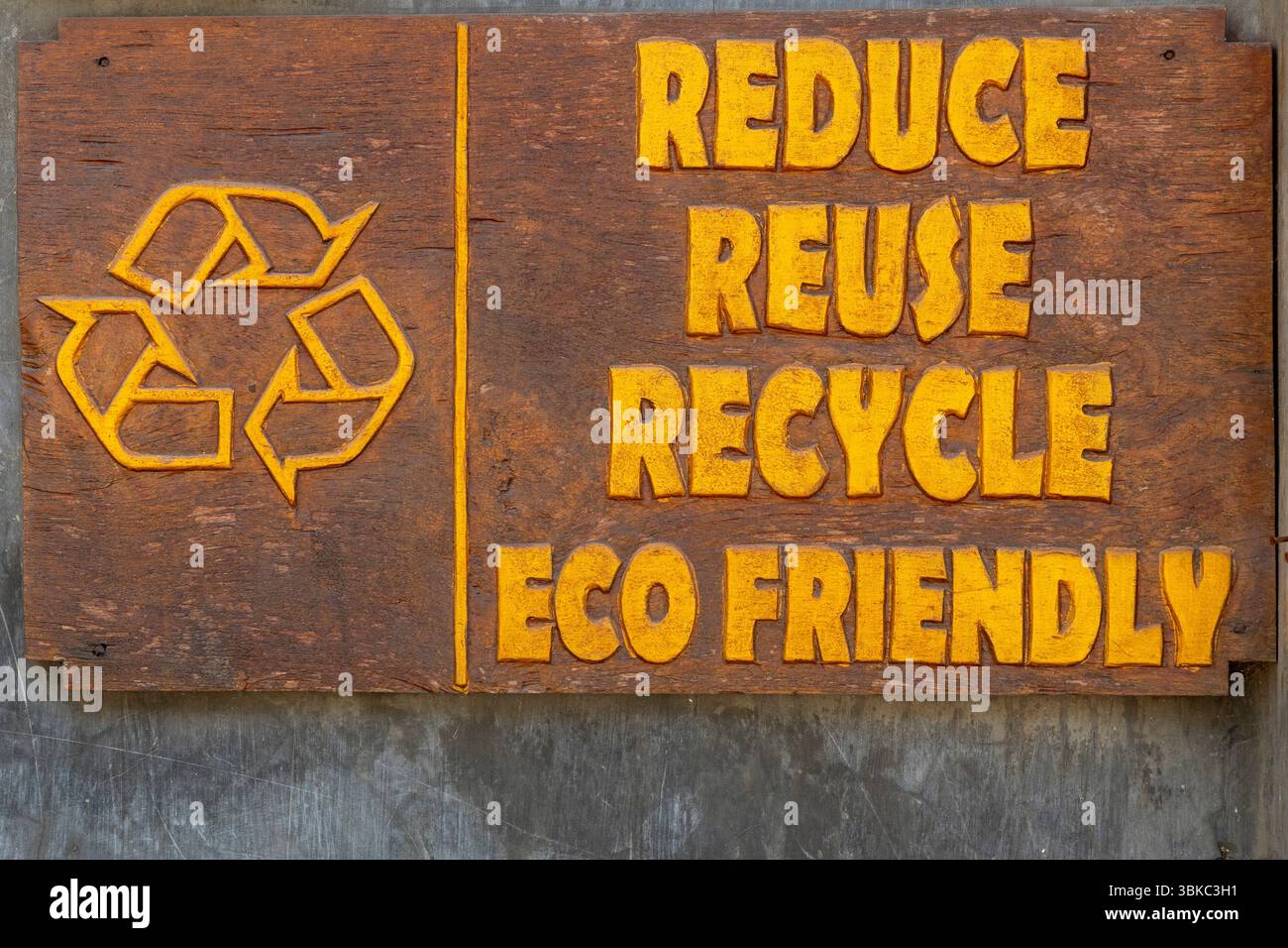 Sign that says Reduce Reuse Recycle Eco Friendly. The sign is on a ...