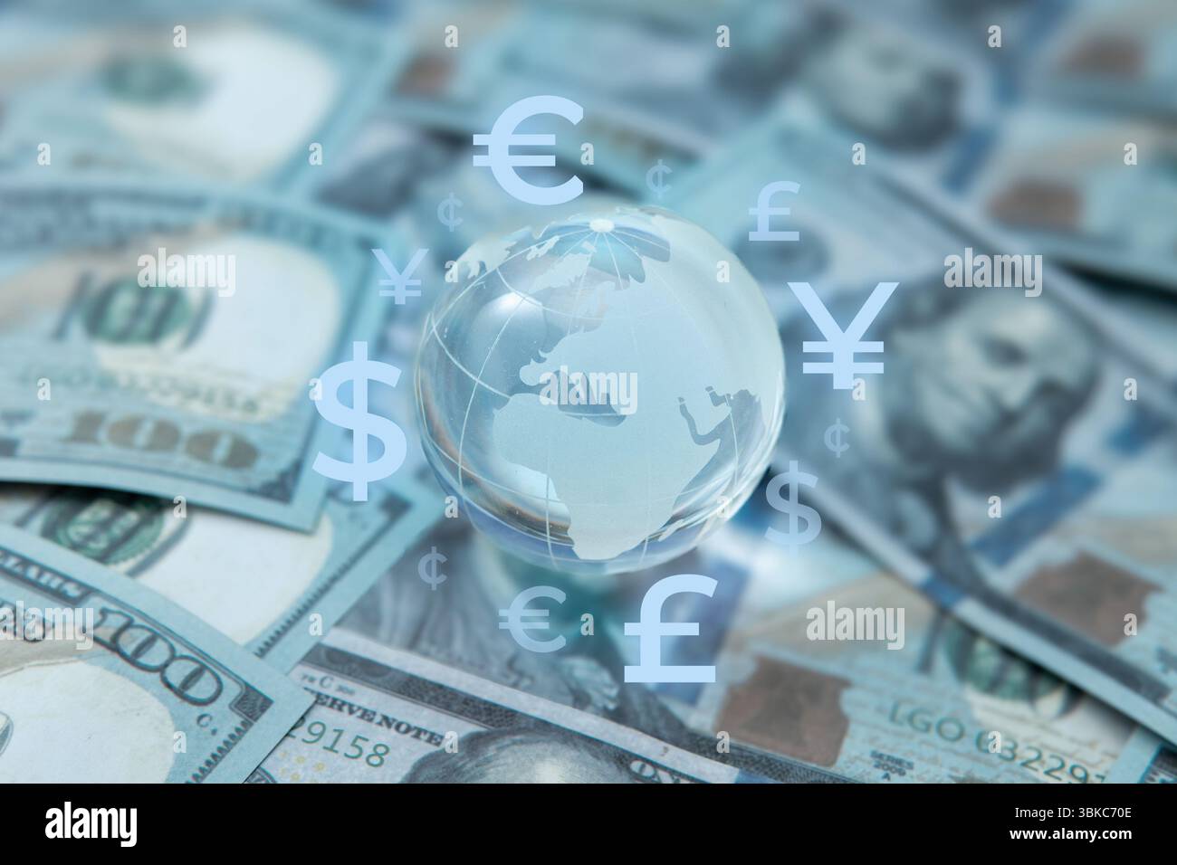 A globe surrounded by various international currency symbols. Global ...