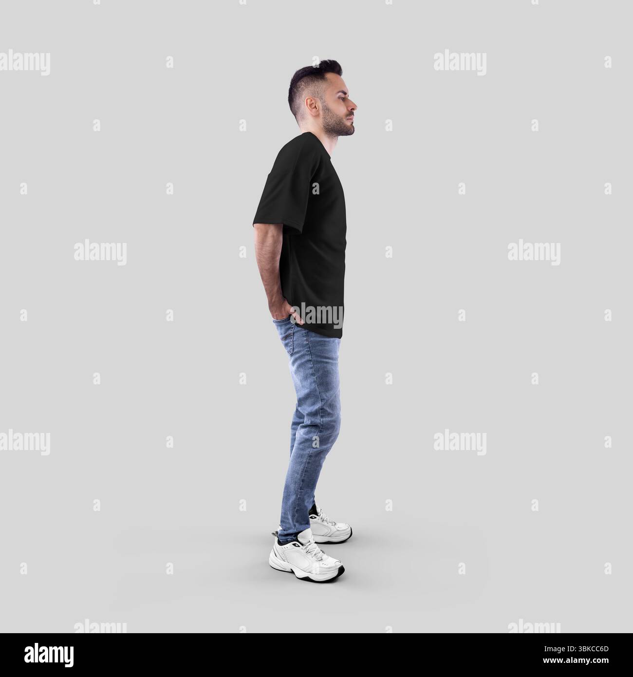 Oversized black t-shirt template on bearded guy, side view, full length ...