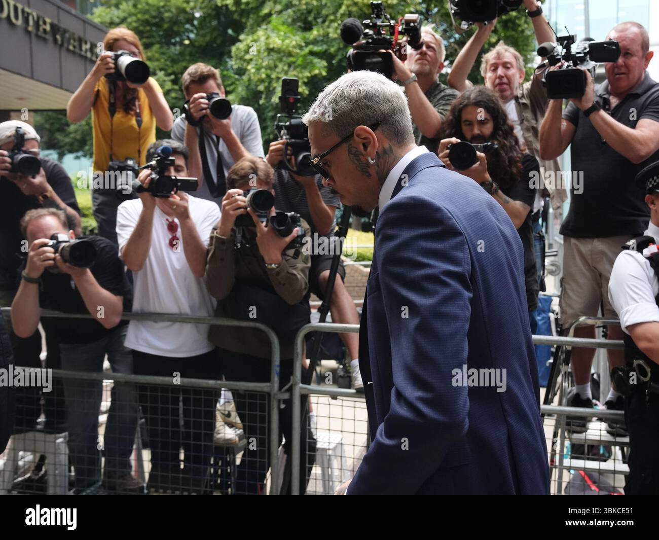 R&B singer Chris Brown arriving at Southwark Crown Court, south London ...