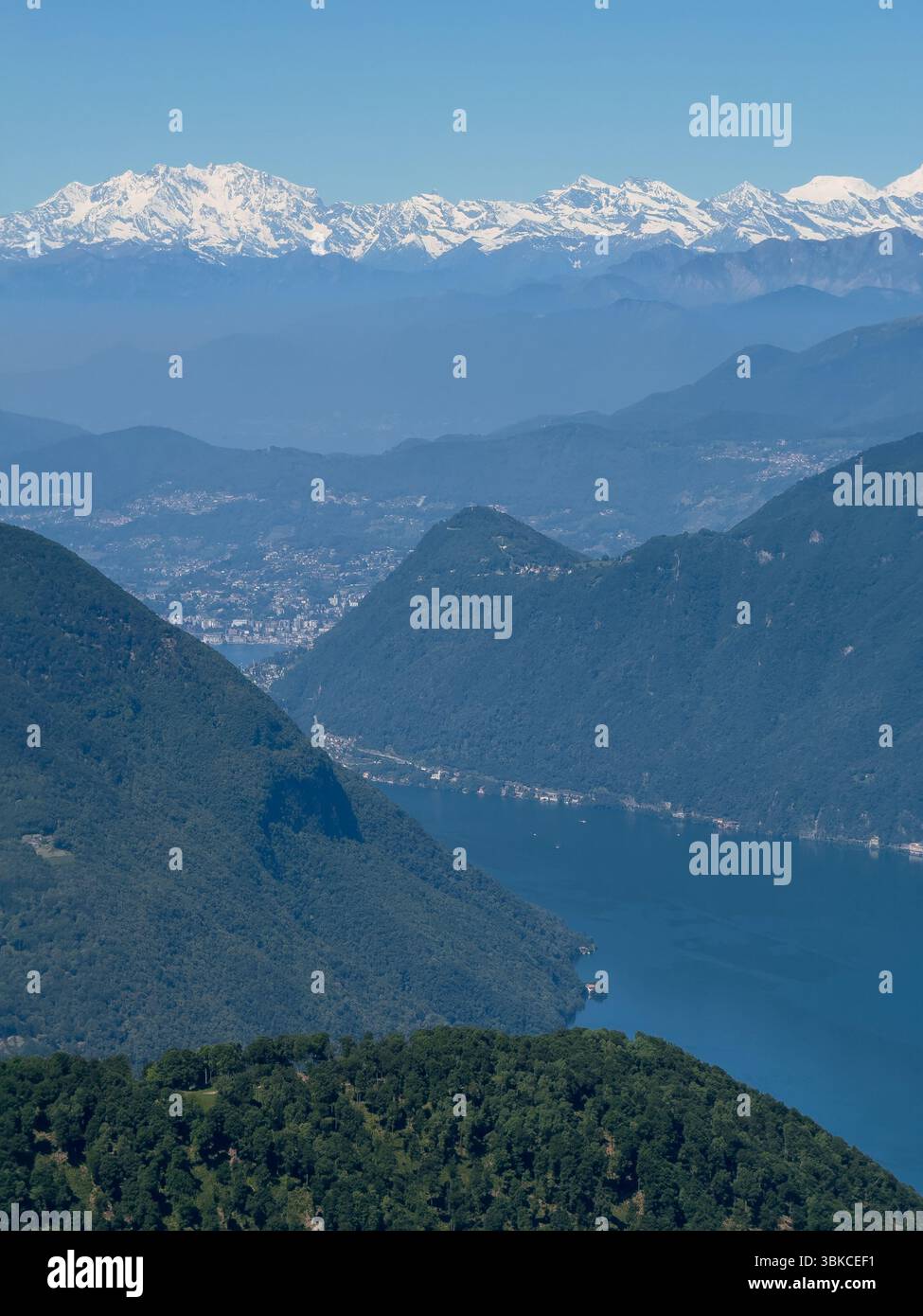 Lake Lugano seen from the top of Mount Galbiga, with the still snow ...