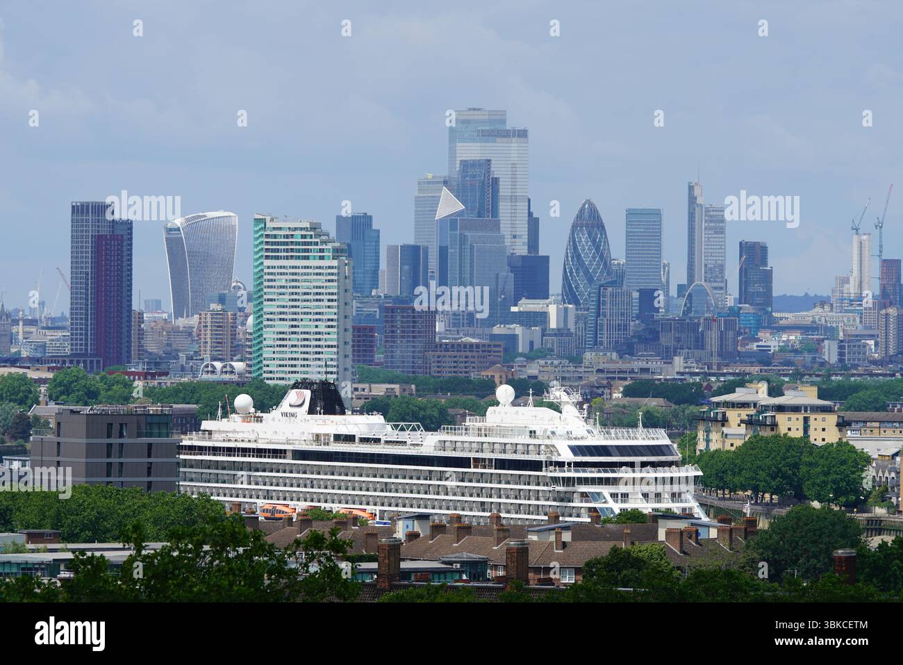 Large Cruise Ship Docked in Urban Landscape with City Skyline ...