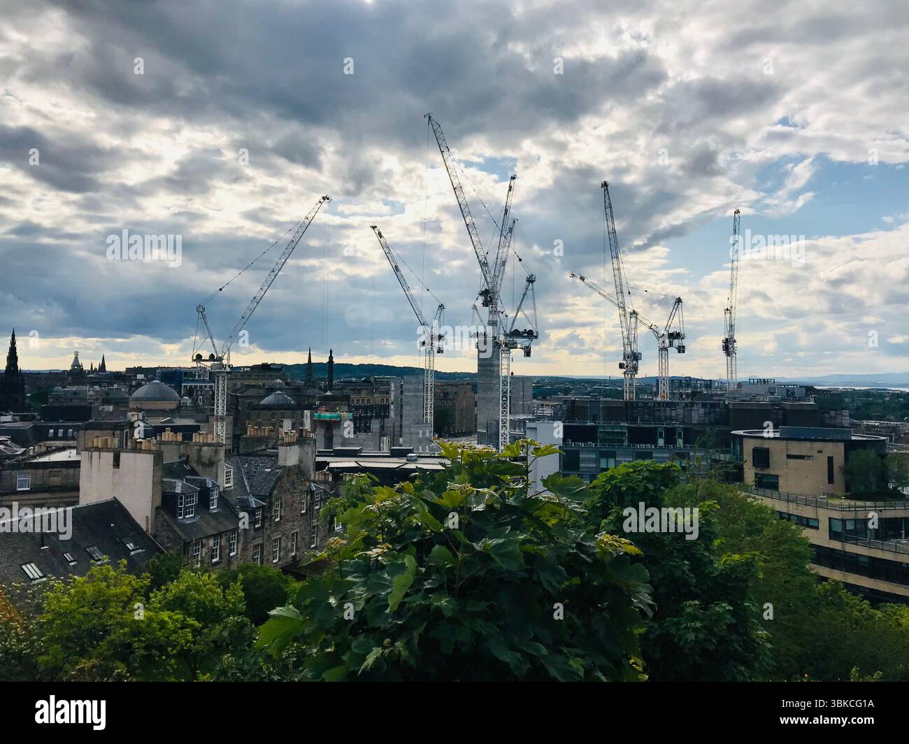 Edinburgh skyline with construction cranes, Scotland Stock Photo - Alamy