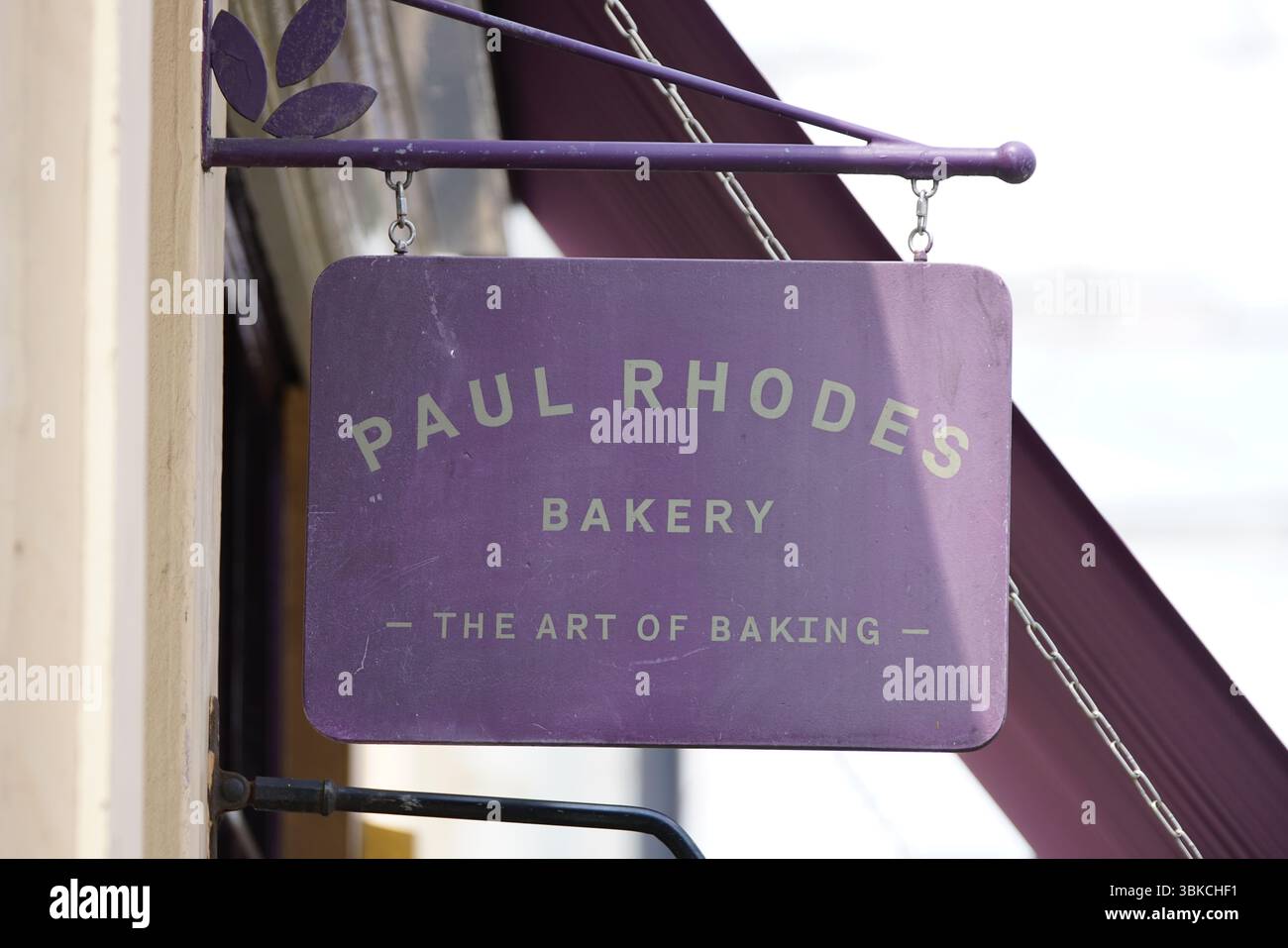 Purple Bakery Sign Showcasing the Art of Baking on an Exterior Wall ...