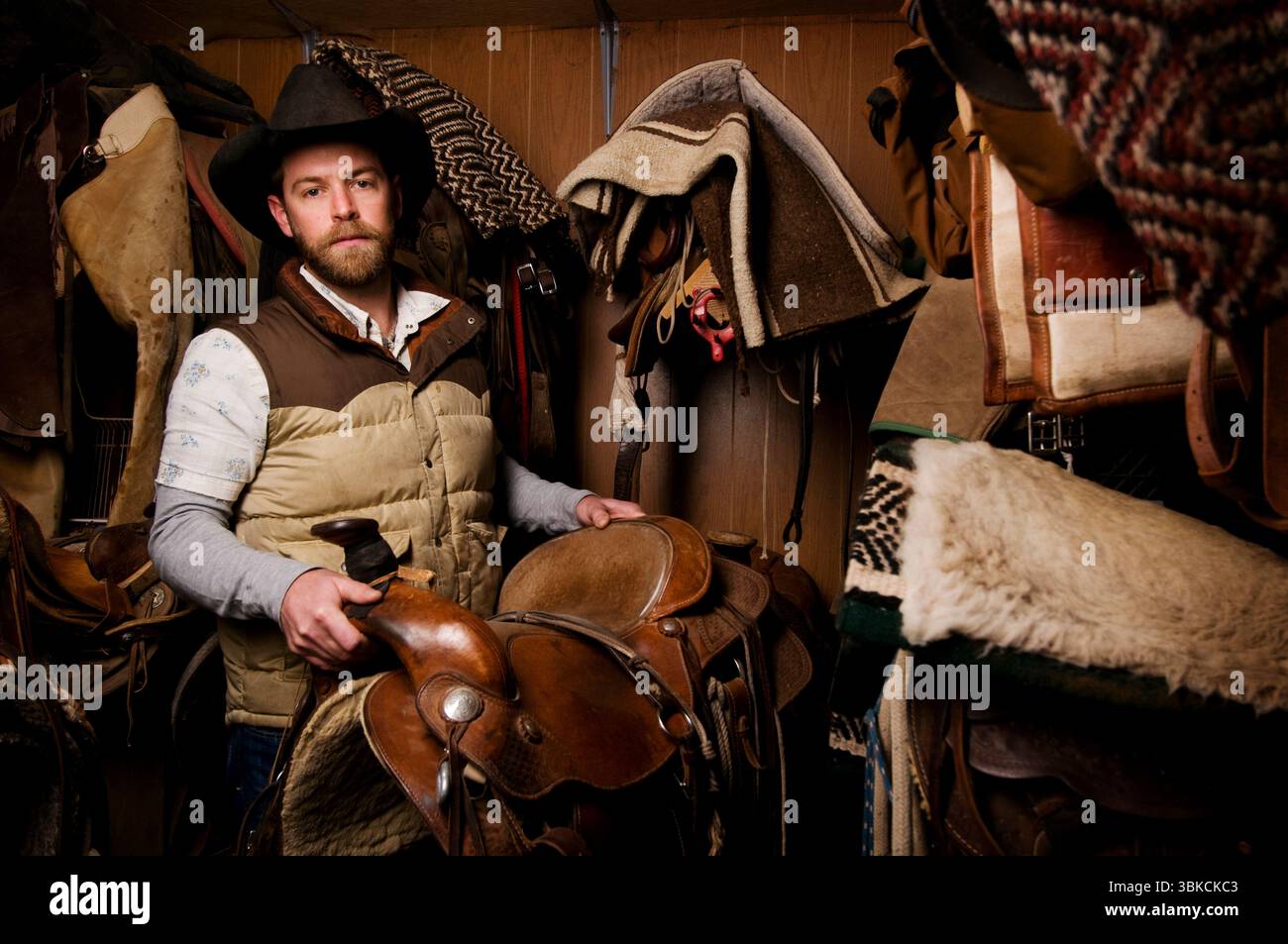 Portrait of a male cowboy, dressed in western attire and a cowboy hat ...