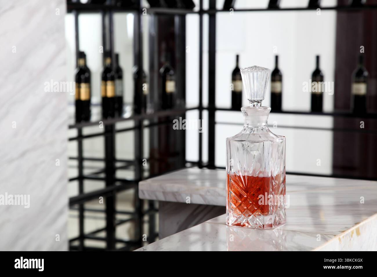 A close-up of a whisky bottle placed on the bar counter Stock Photo - Alamy