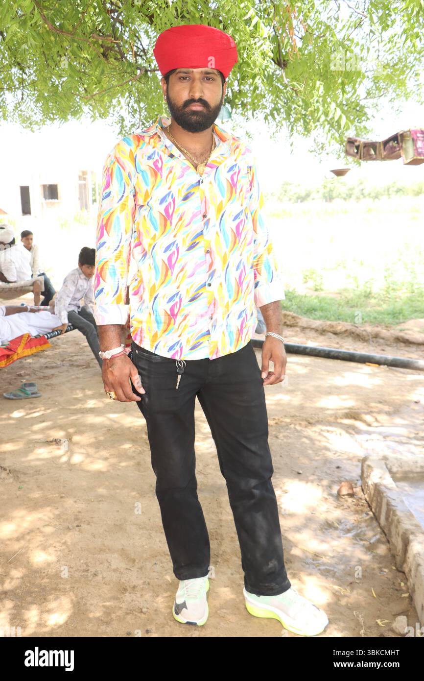 Gujarati man wearing traditional turban standing outdoors, 30 years old ...