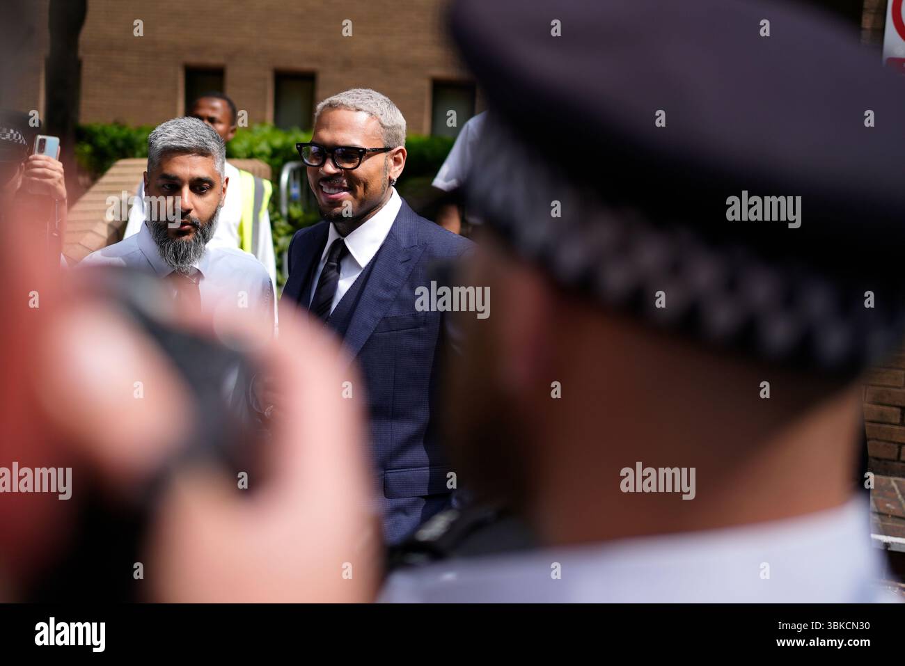 R&B singer Chris Brown leaves Southwark Crown Court, south London ...