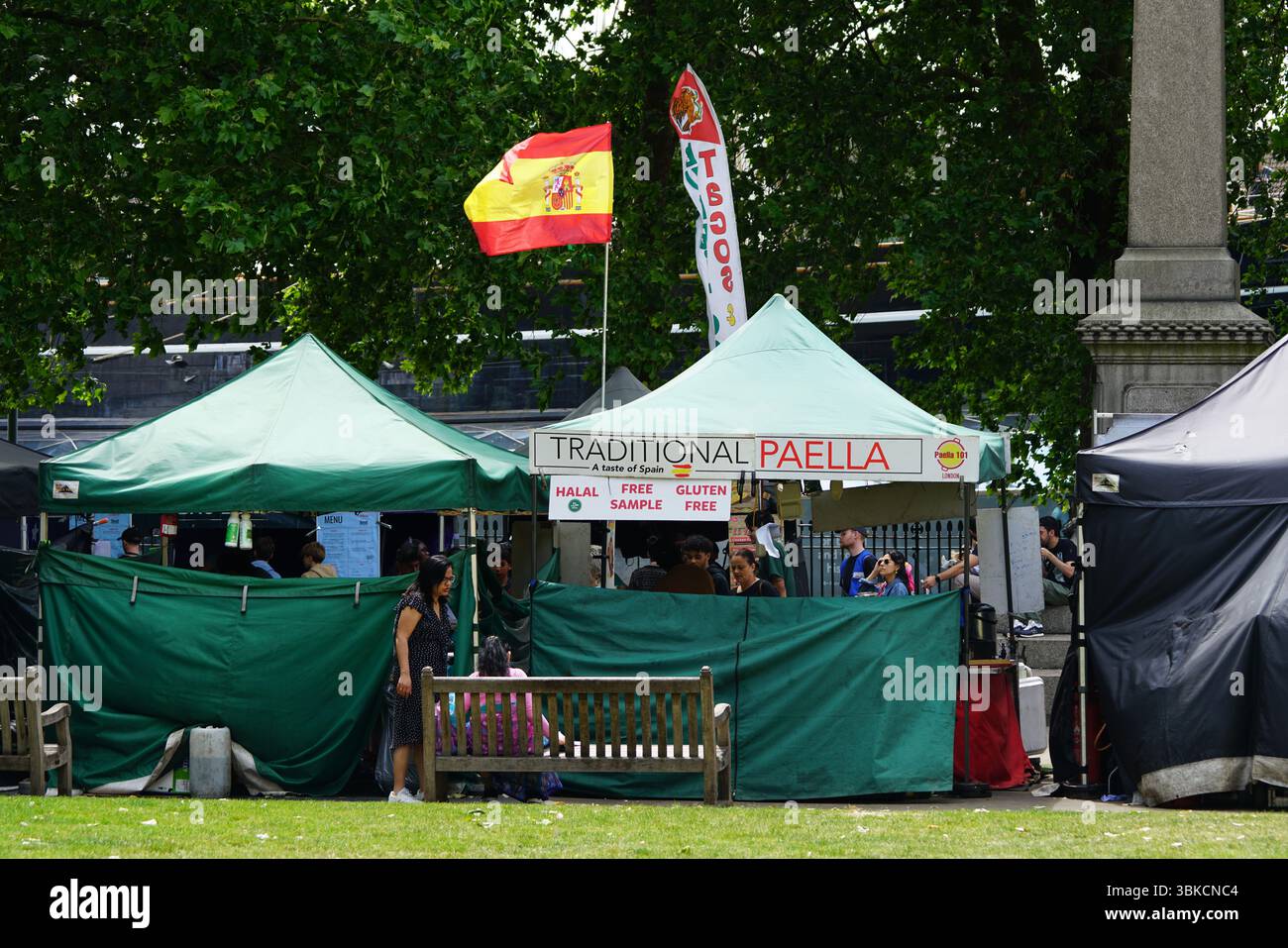 Spanish Paella Stall at an Outdoor Festival Under Green Tents ...