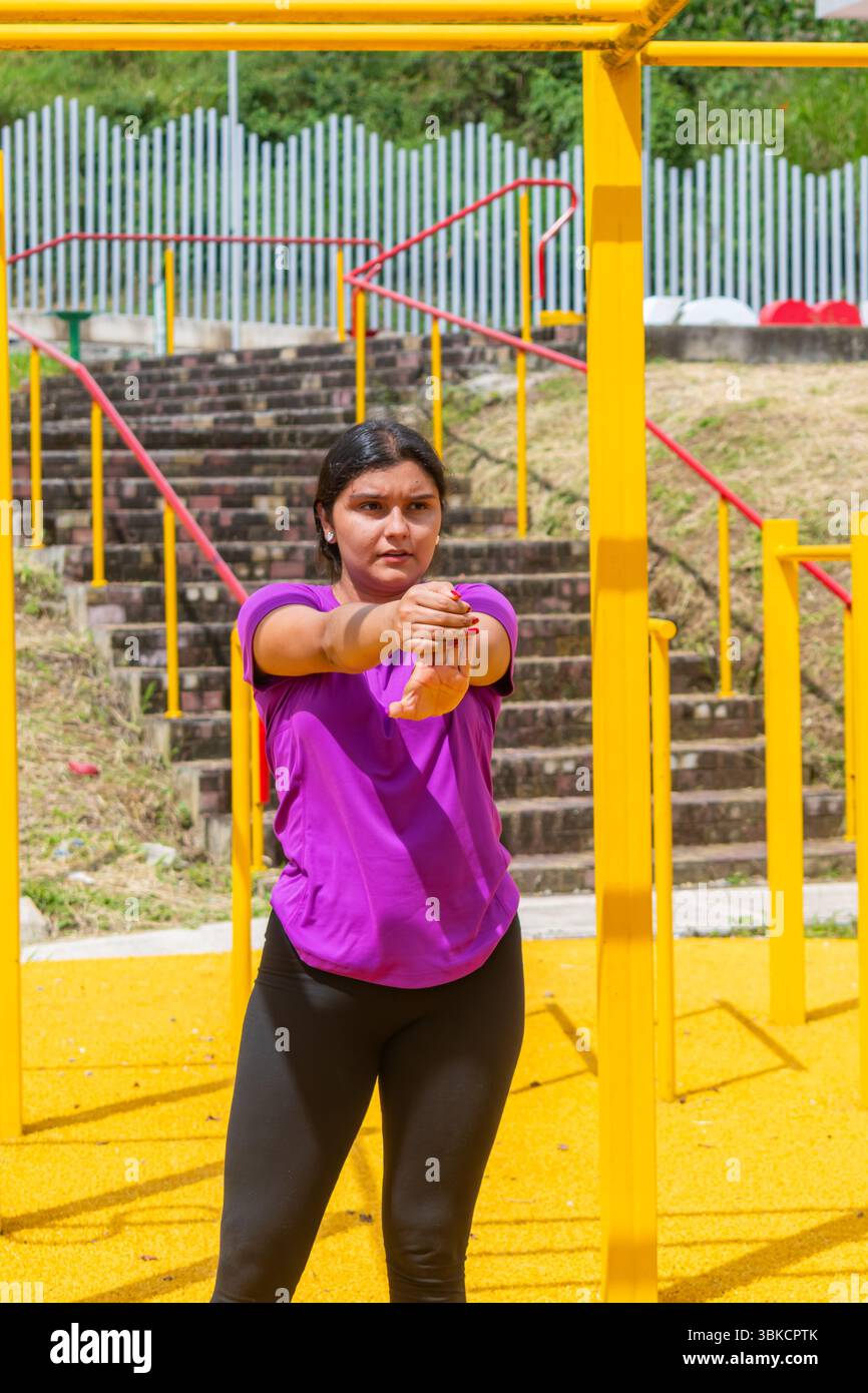 Confident Arm Stretch at Outdoor Gym Stock Photo - Alamy