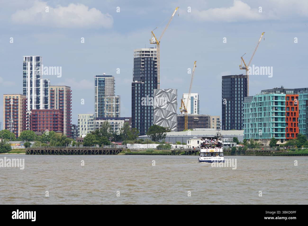 Modern Urban Waterfront Scene with Boats and Tall City Buildings ...
