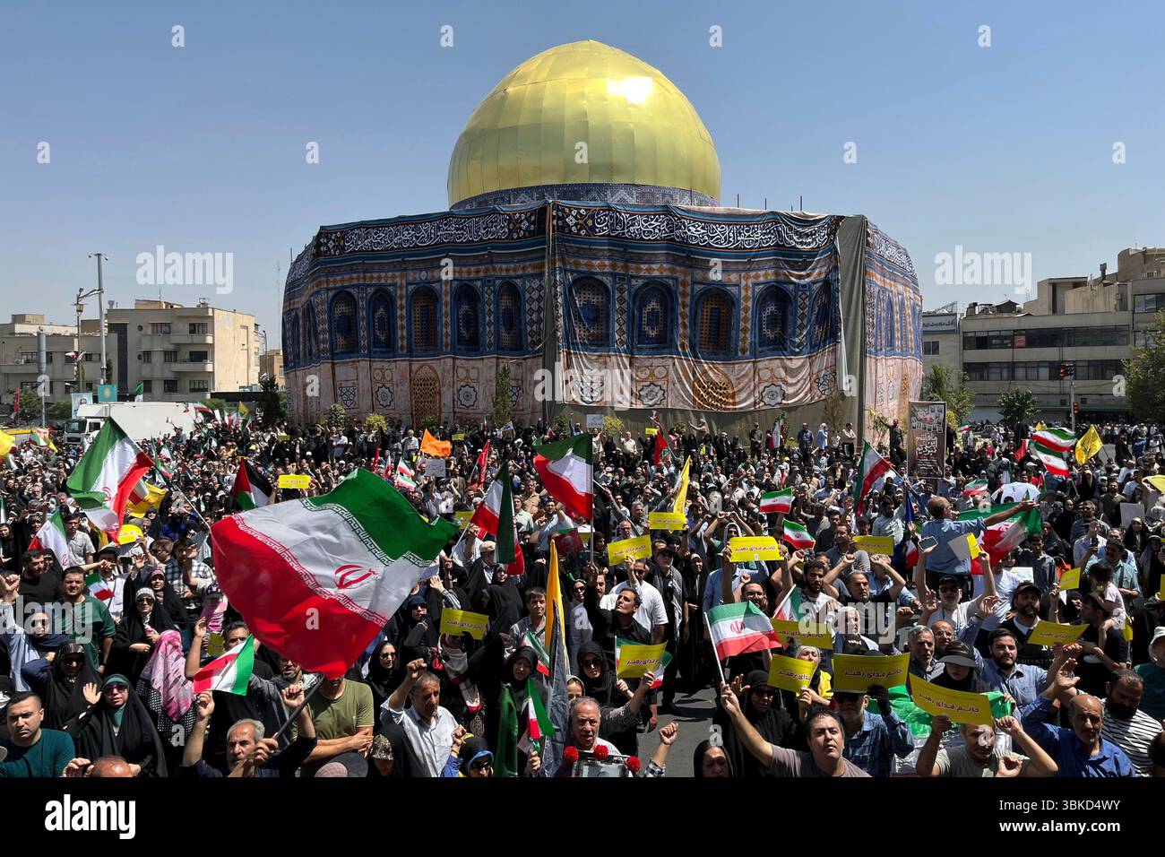 Iranian worshippers wave Iranian flags during a protest against Israeli ...